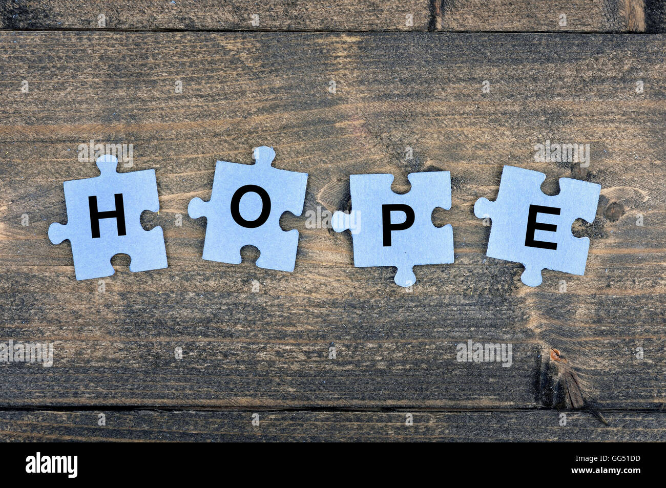 Puzzle pieces with word Hope Stock Photo - Alamy