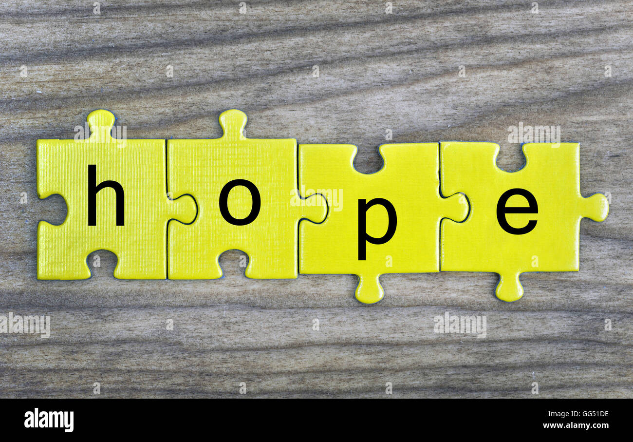 Puzzle pieces with word Hope Stock Photo - Alamy