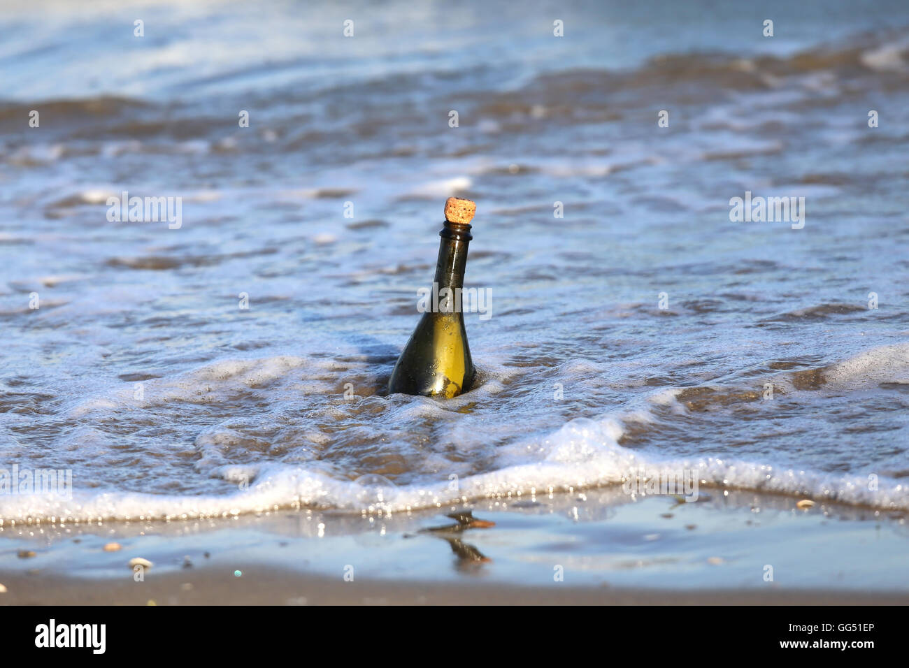Secret Message in the glass bottle in the sea Stock Photo - Alamy