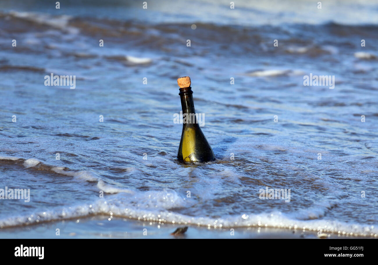 Secret Message in the glass bottle on the beach Stock Photo - Alamy