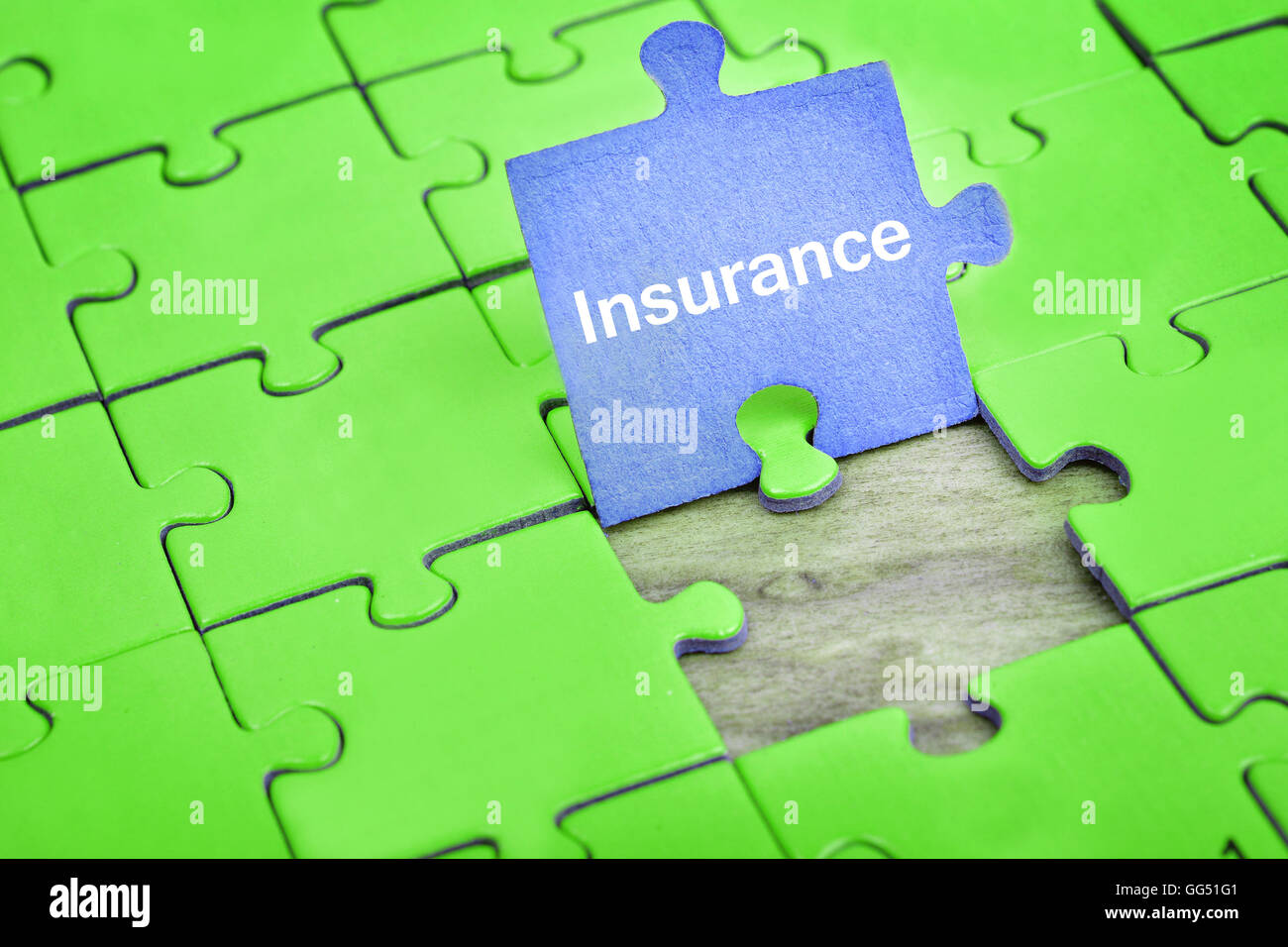 Puzzle pieces with word Insurance Stock Photo - Alamy