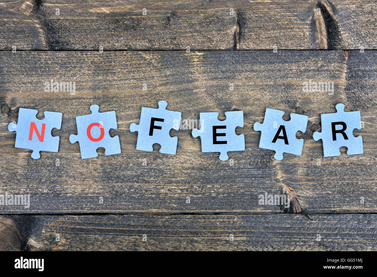 Puzzle pieces with word No fear Stock Photo - Alamy
