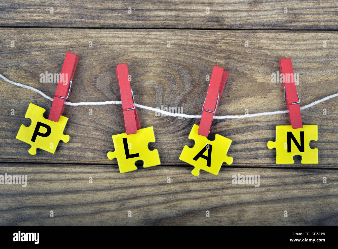 Puzzle pieces with word Plan Stock Photo - Alamy