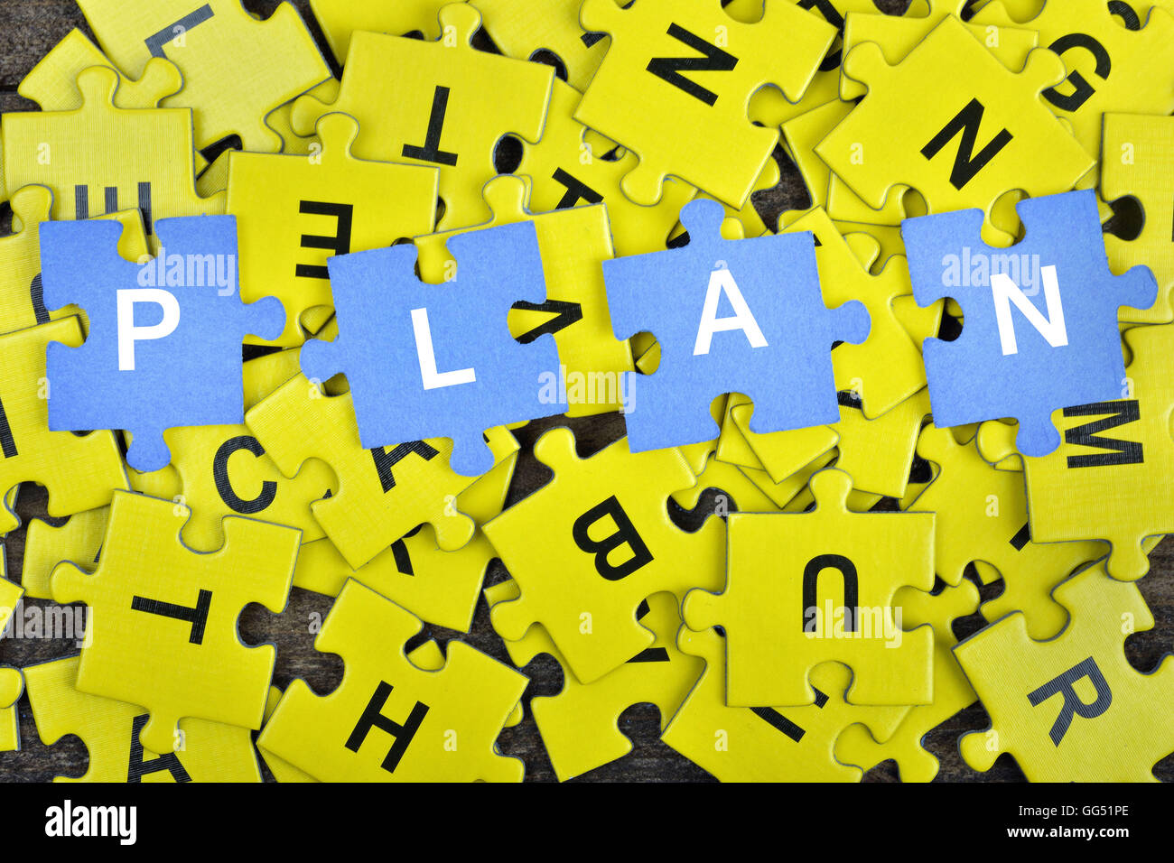 Puzzle pieces with word Plan Stock Photo - Alamy