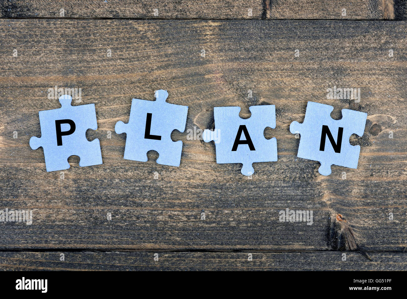Puzzle pieces with word Plan Stock Photo - Alamy