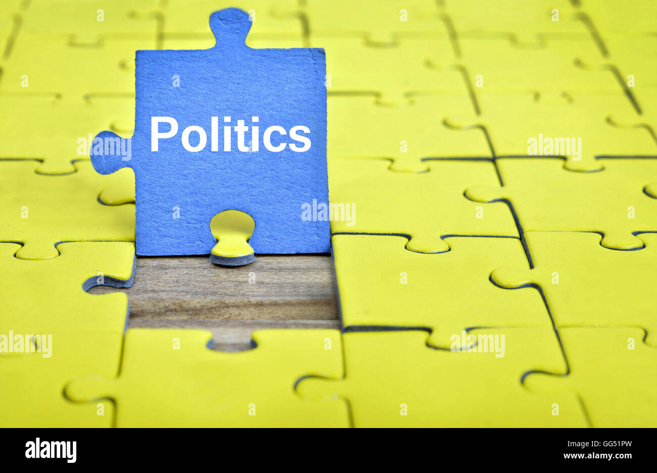 Puzzle pieces with word Politics Stock Photo - Alamy