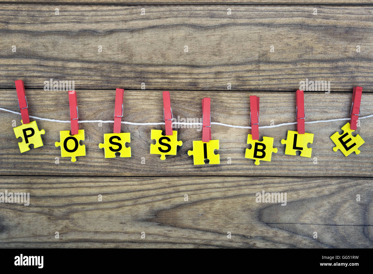 Puzzle pieces with word Possible Stock Photo - Alamy