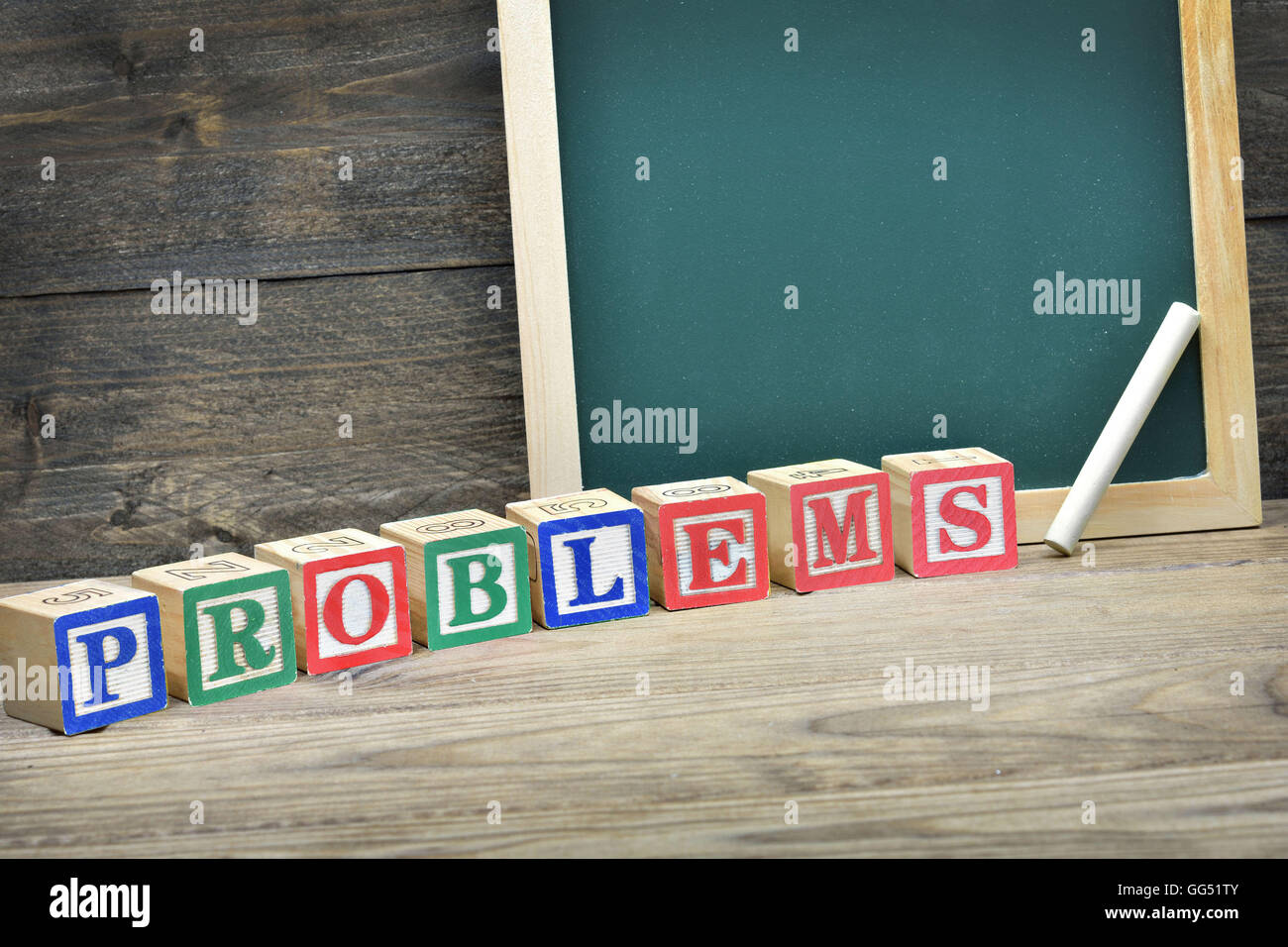 School board and word Problems on wooden table Stock Photo - Alamy