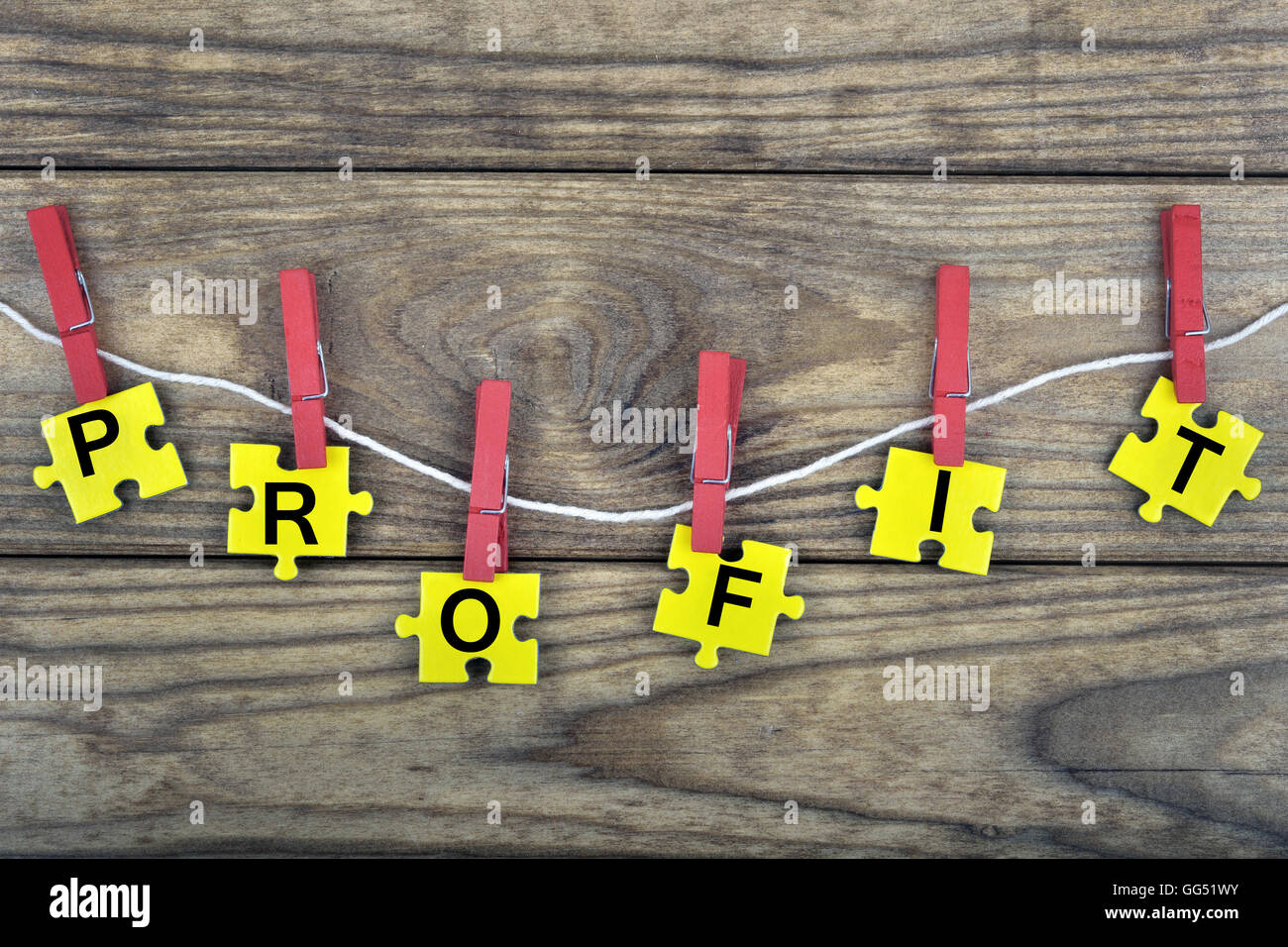 Puzzle pieces with word Profit Stock Photo - Alamy