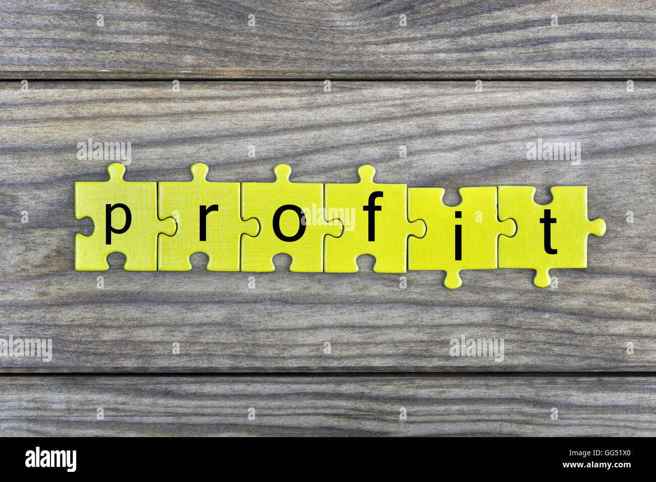 Puzzle pieces with word Profit Stock Photo - Alamy