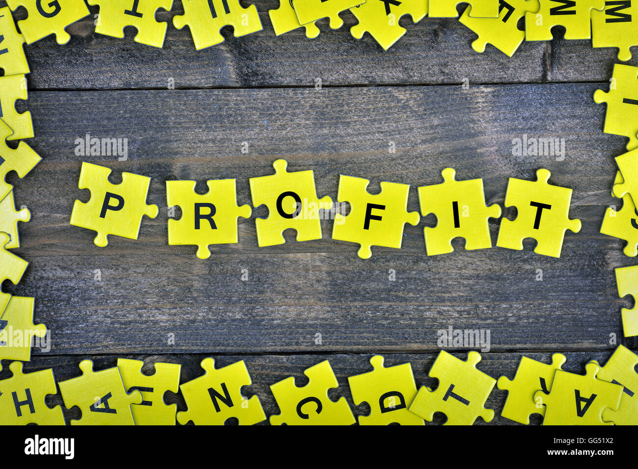 Puzzle pieces with word Profit Stock Photo - Alamy