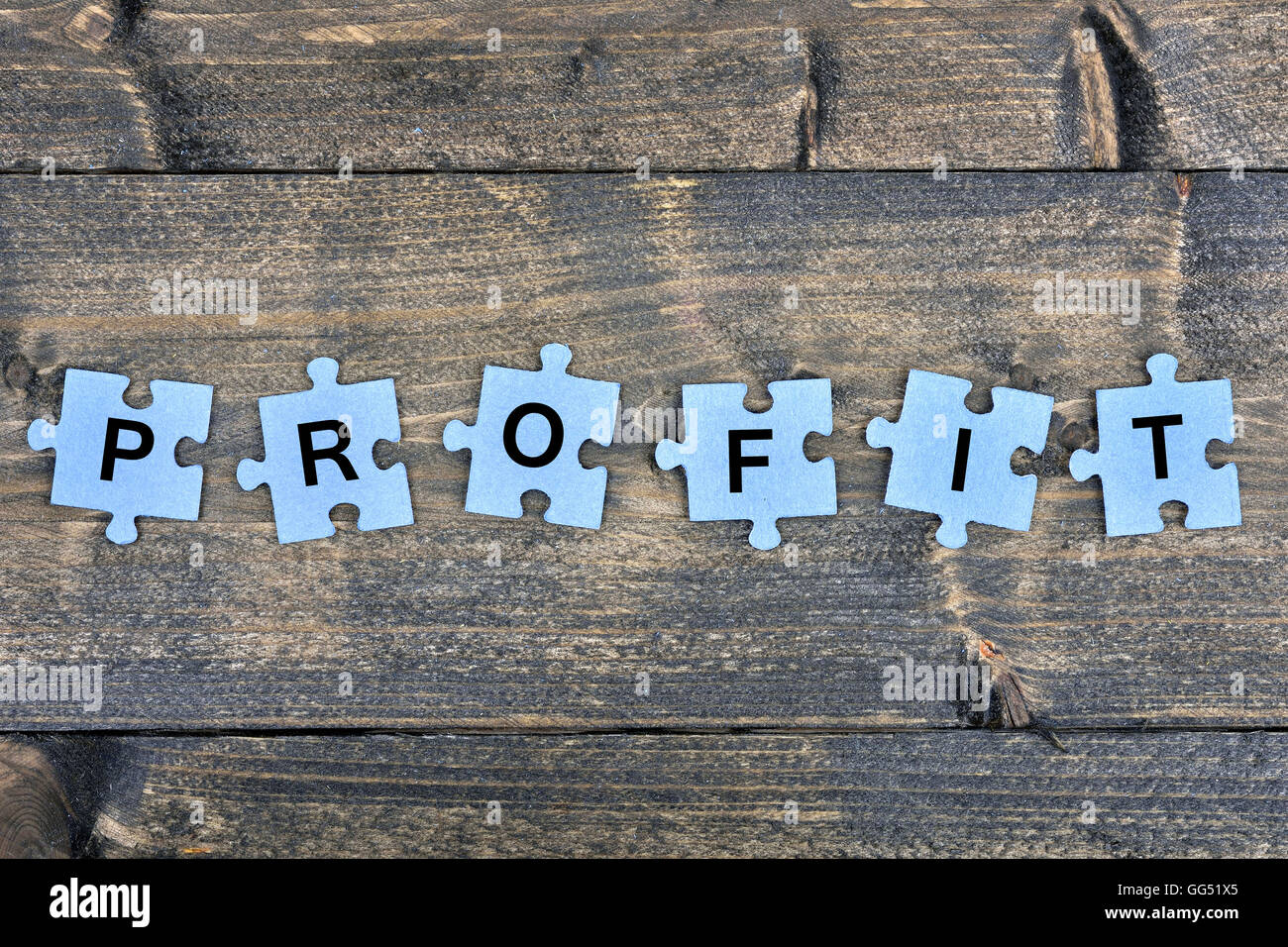 Puzzle pieces with word Profit Stock Photo - Alamy