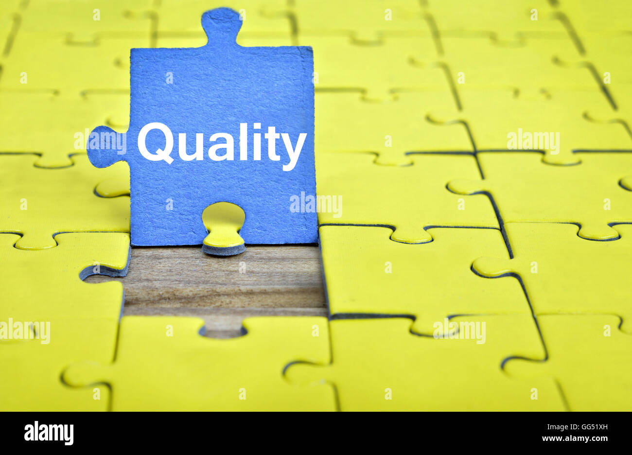 Puzzle pieces with word Quality Stock Photo - Alamy