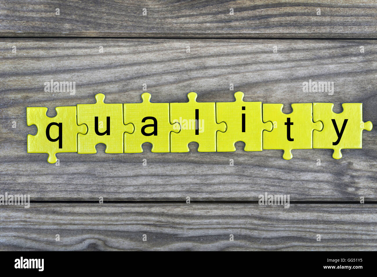 Puzzle pieces with word Quality Stock Photo - Alamy