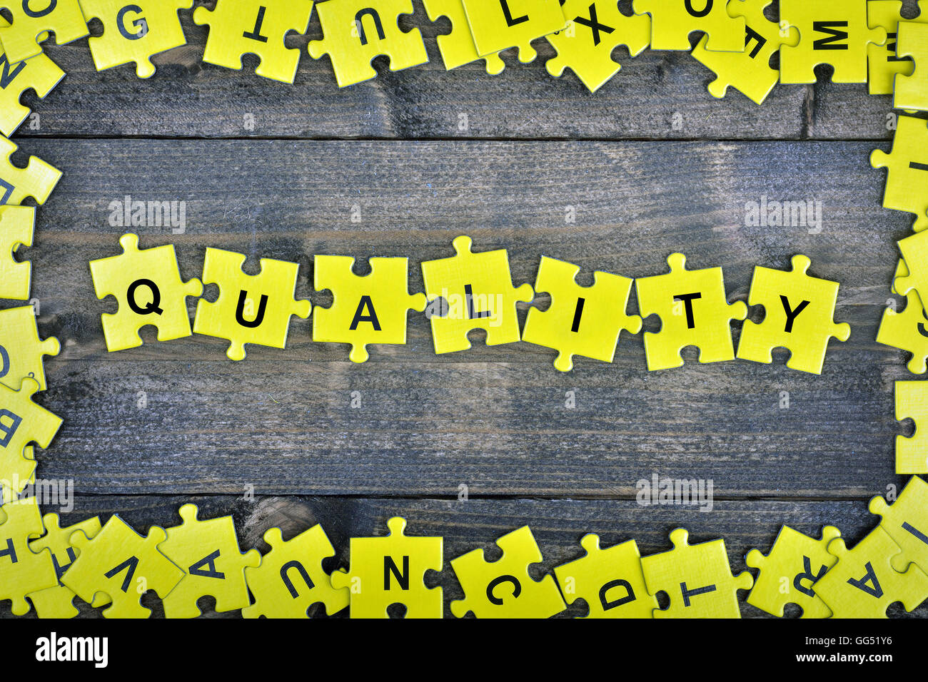 Puzzle pieces with word Quality Stock Photo - Alamy