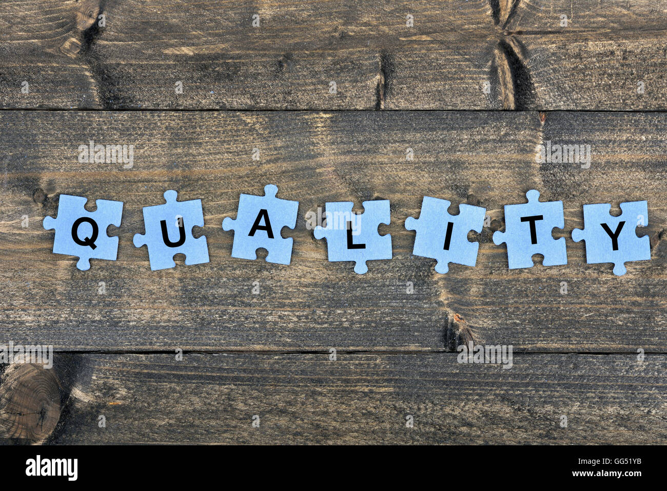 Puzzle pieces with word Quality Stock Photo - Alamy