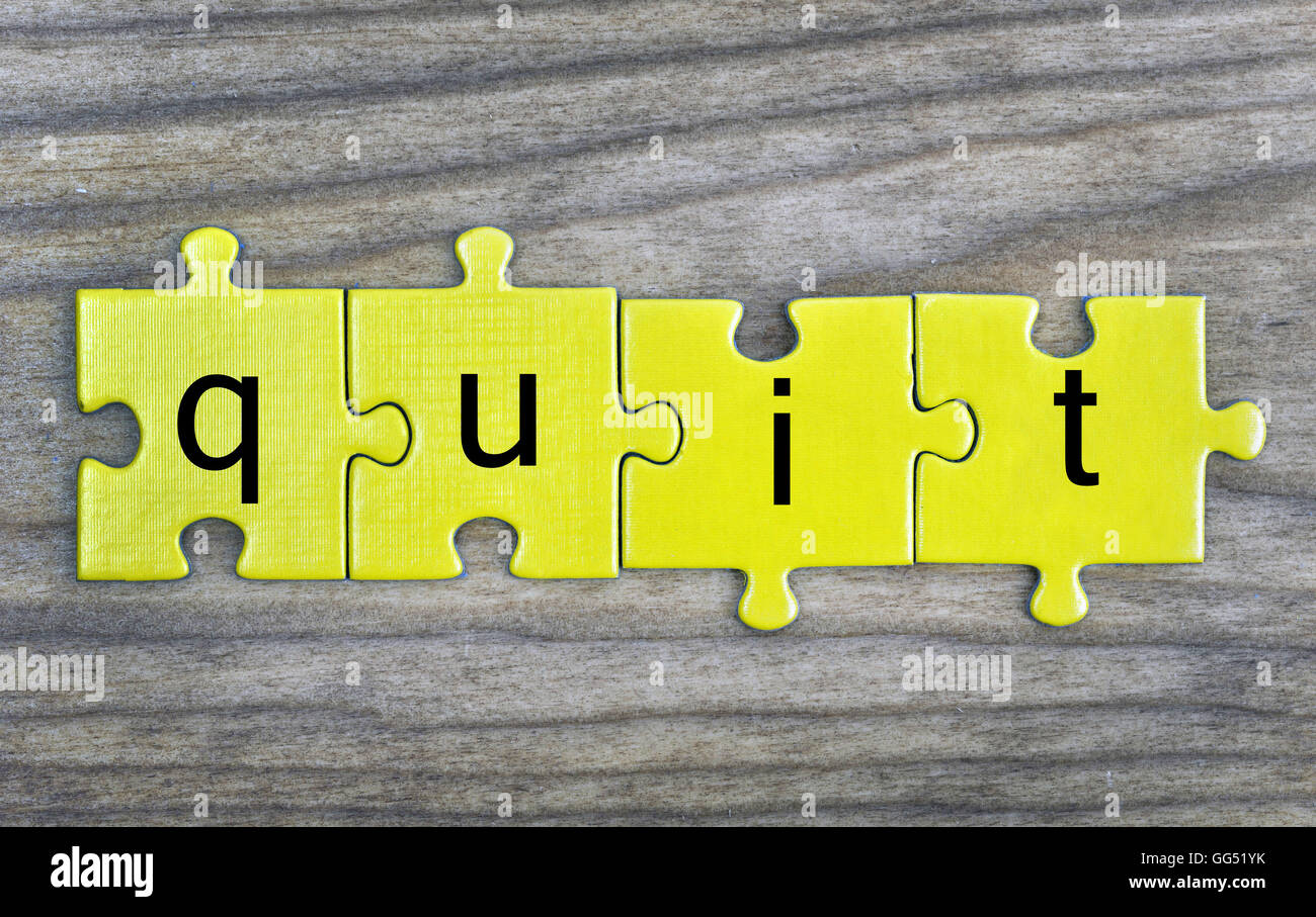 Puzzle pieces with word Quit Stock Photo - Alamy