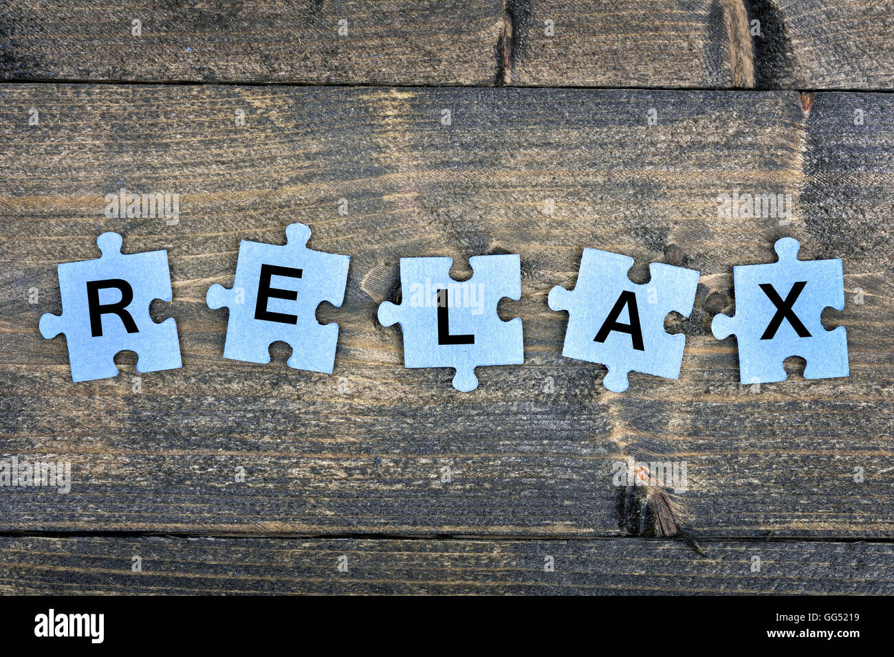 Puzzle pieces with word Relax Stock Photo - Alamy