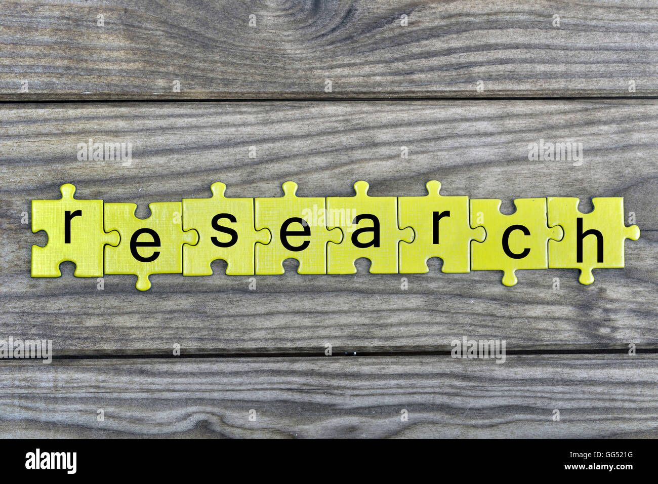 Puzzle pieces with word Research Stock Photo - Alamy