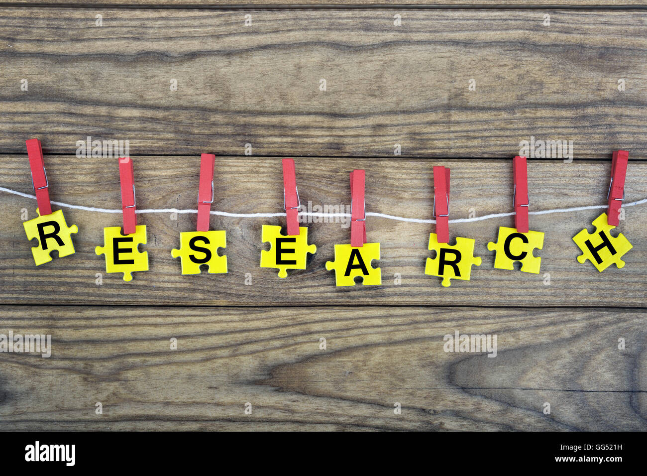 Puzzle pieces with word Research Stock Photo - Alamy