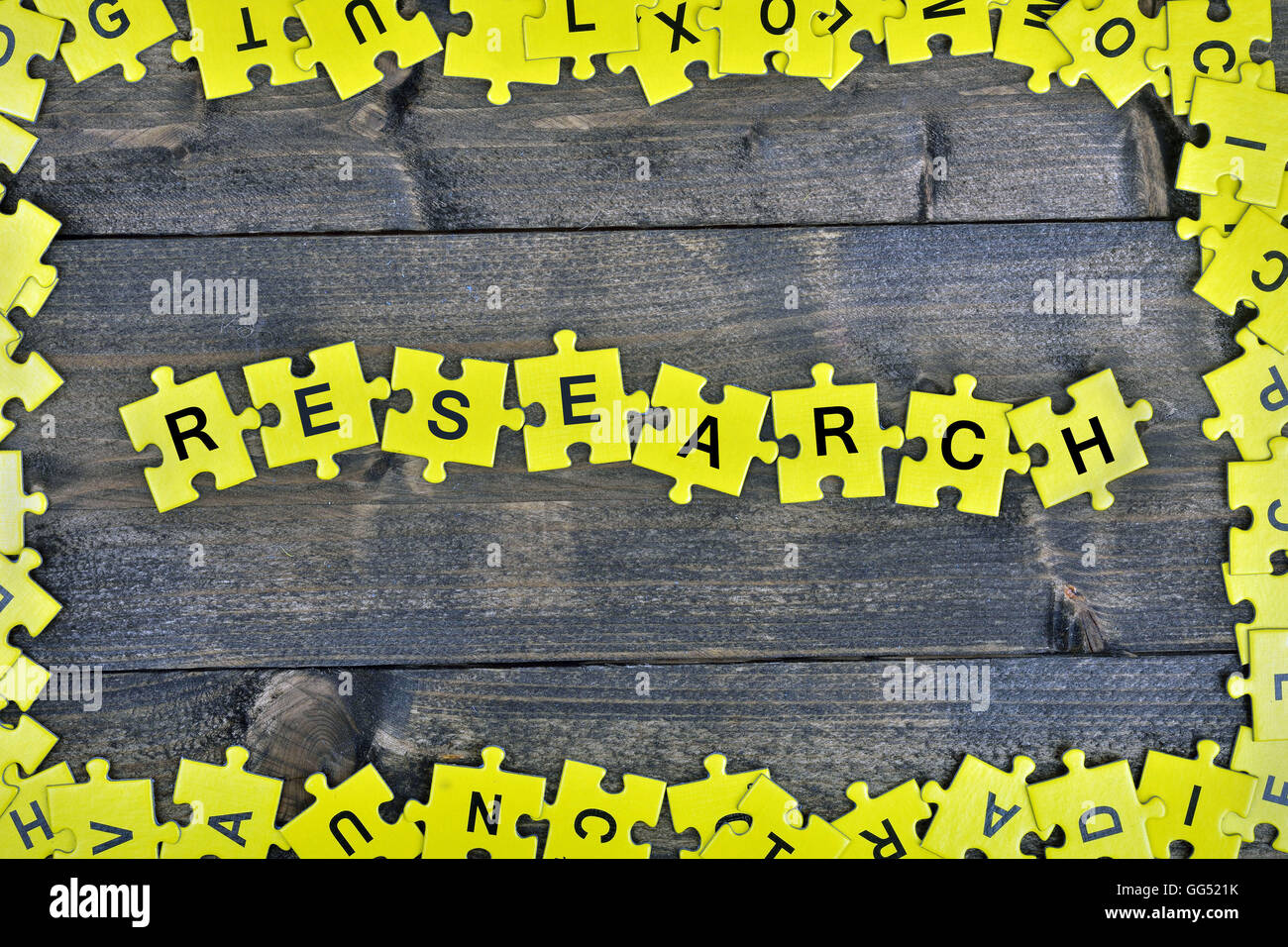 Puzzle pieces with word Research Stock Photo - Alamy