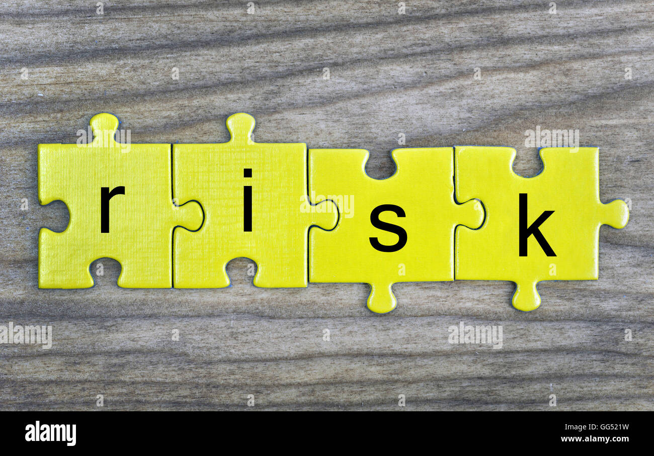 Puzzle pieces with word Risk Stock Photo - Alamy