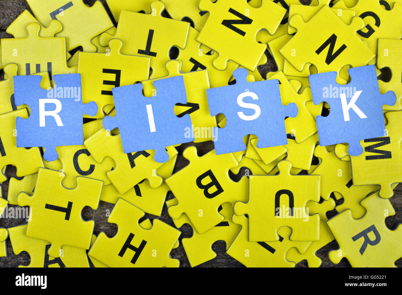 Puzzle pieces with word Risk Stock Photo - Alamy