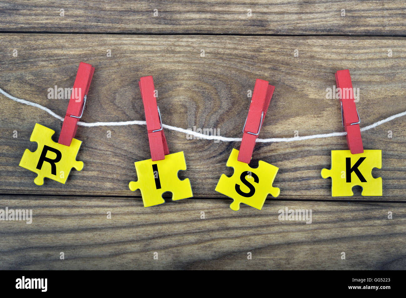 Puzzle pieces with word Risk Stock Photo - Alamy