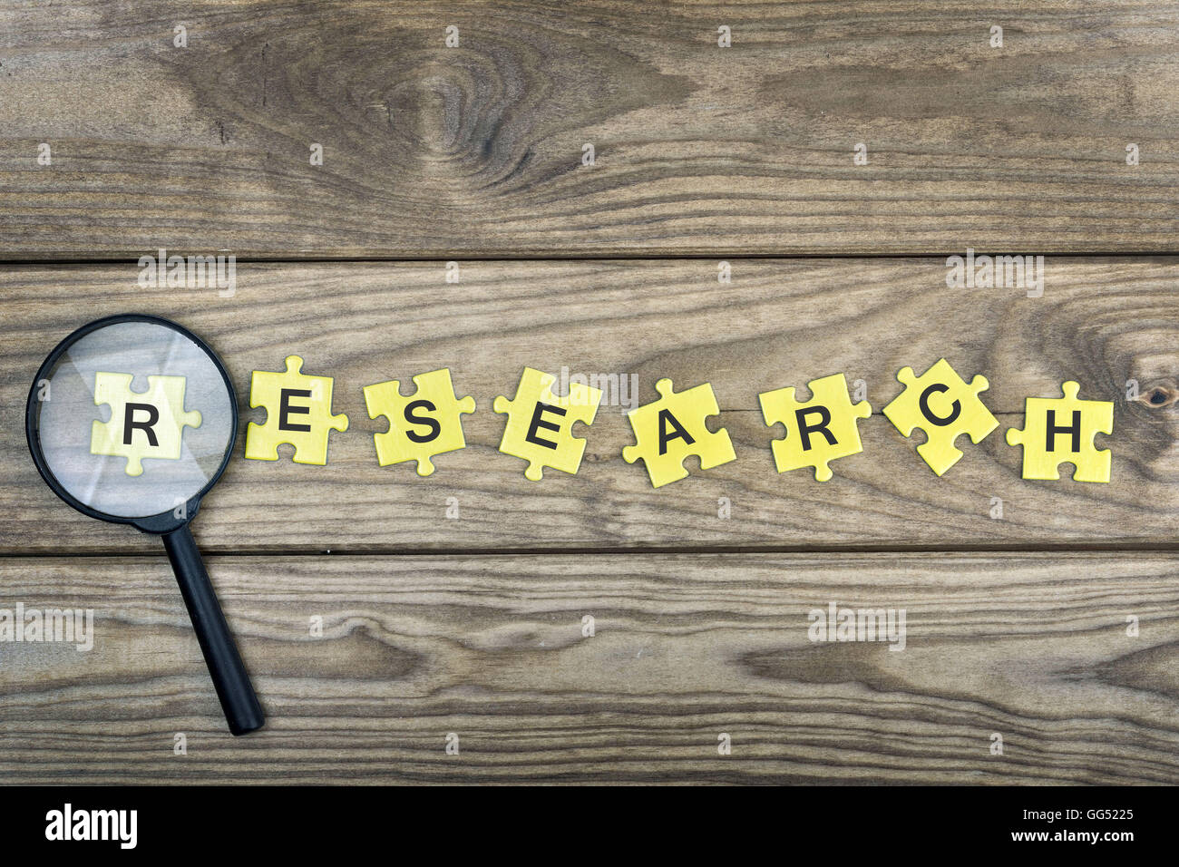Puzzle pieces with word Research Stock Photo - Alamy