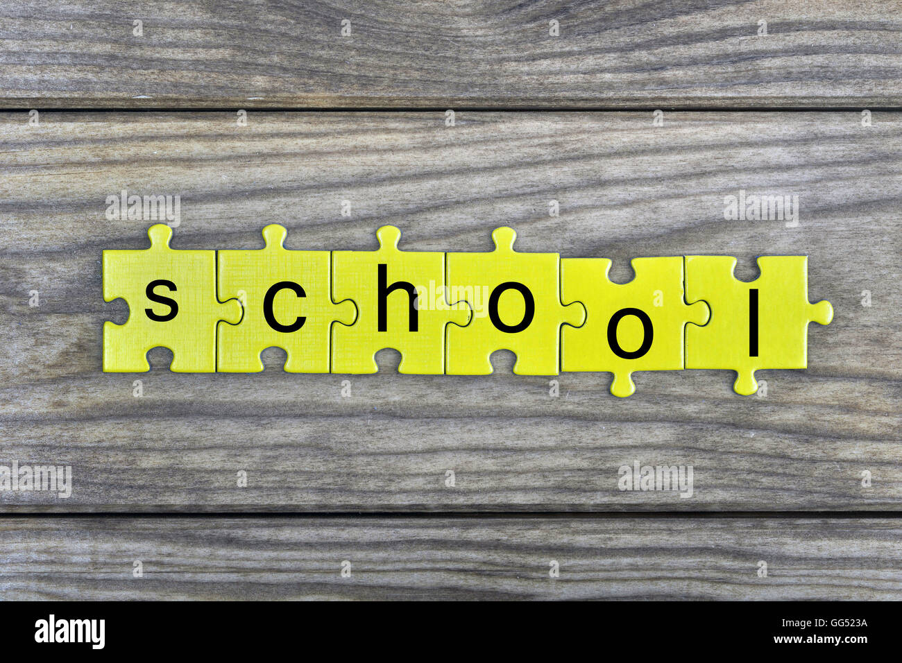 Puzzle pieces with word School Stock Photo - Alamy