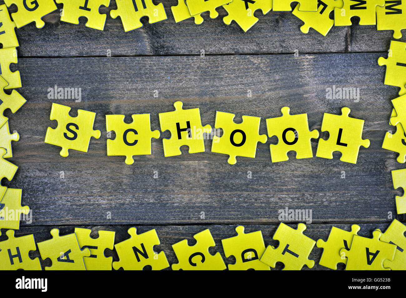 Puzzle pieces with word School Stock Photo - Alamy