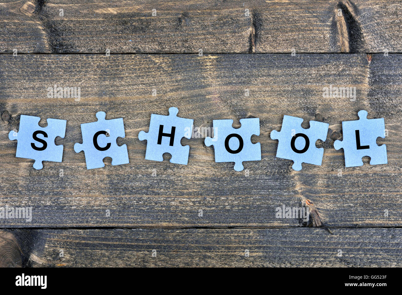 Puzzle pieces with word School Stock Photo - Alamy