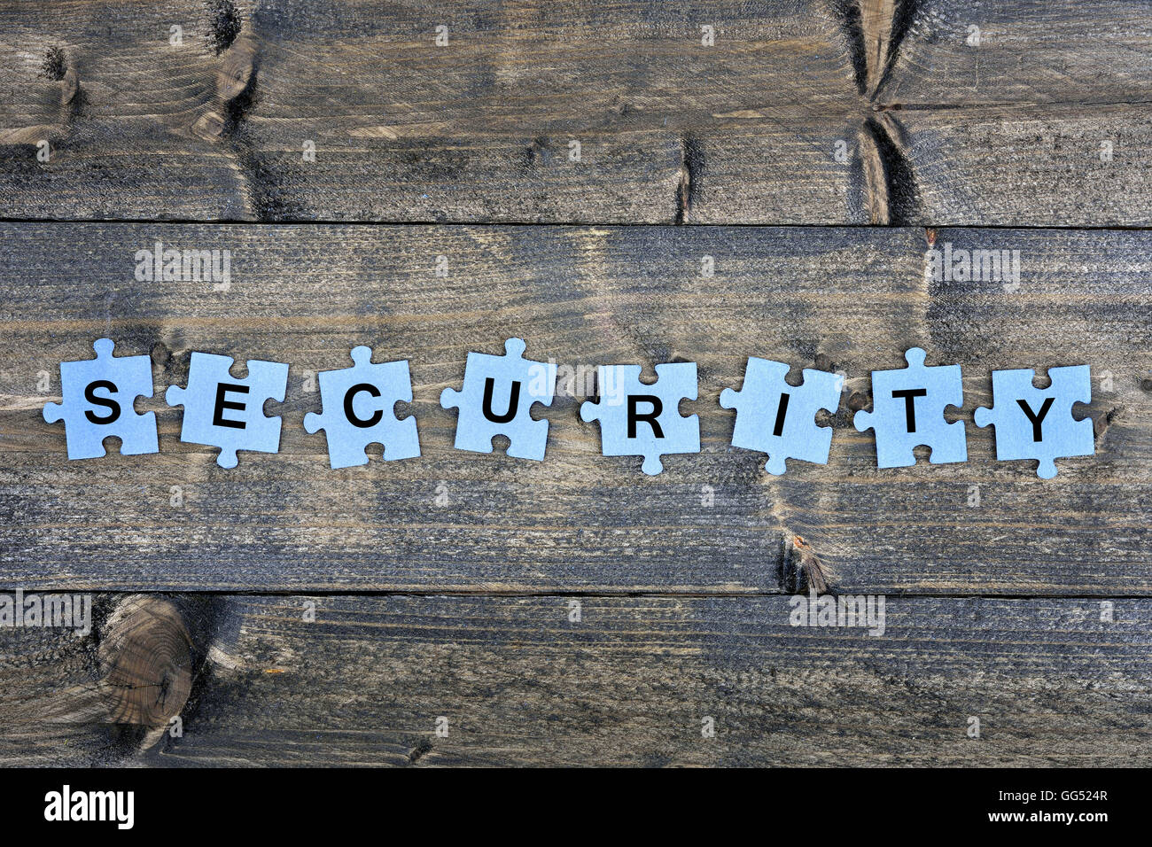 Puzzle pieces with word Security Stock Photo - Alamy