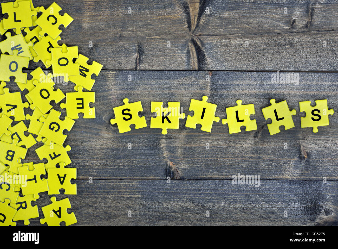 Puzzle pieces with word Skills Stock Photo - Alamy