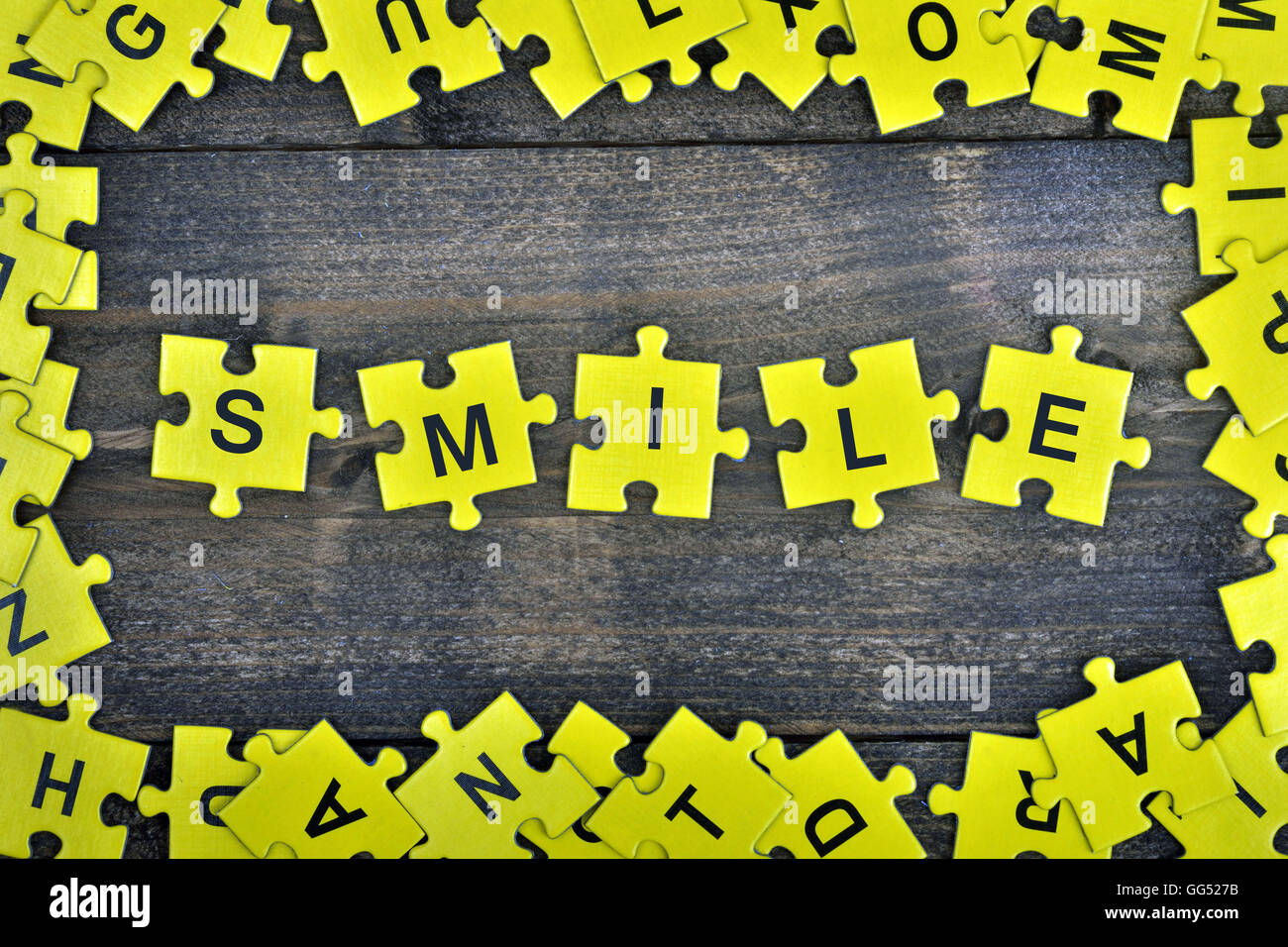 Puzzle pieces with word Smile Stock Photo - Alamy