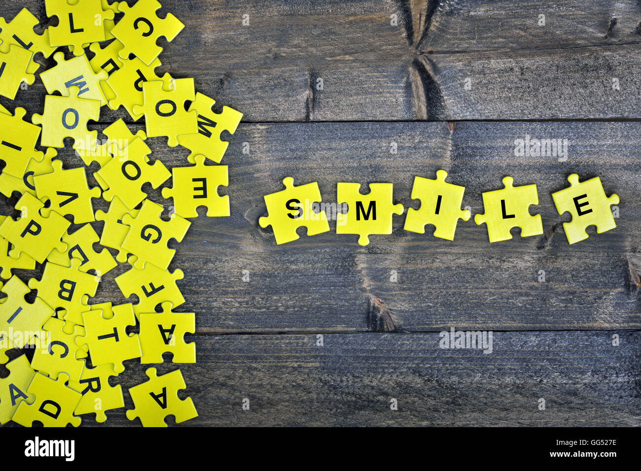 Puzzle pieces with word Smile Stock Photo - Alamy