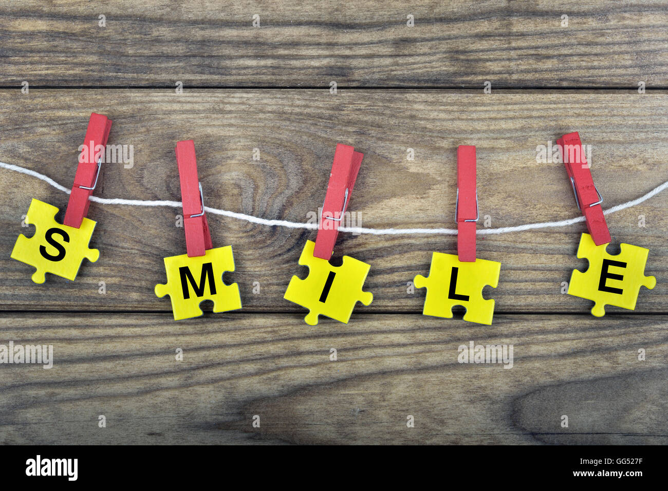 Puzzle pieces with word Smile Stock Photo - Alamy