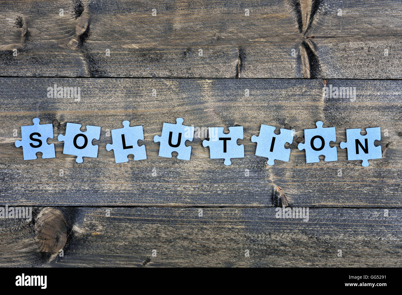Puzzle pieces with word Solution Stock Photo - Alamy