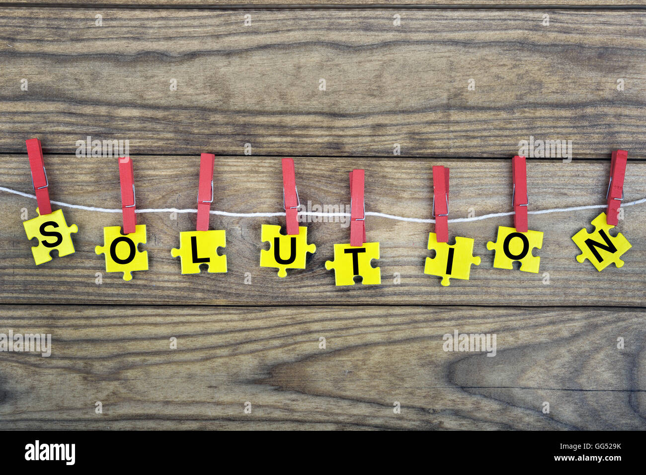 Puzzle pieces with word Solution Stock Photo - Alamy