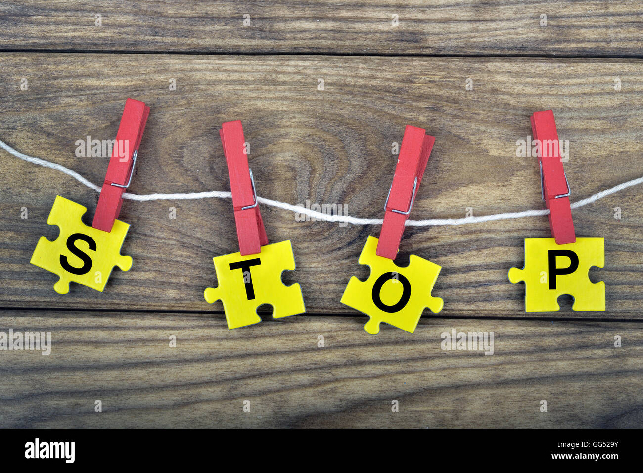 Puzzle pieces with word Stop Stock Photo - Alamy