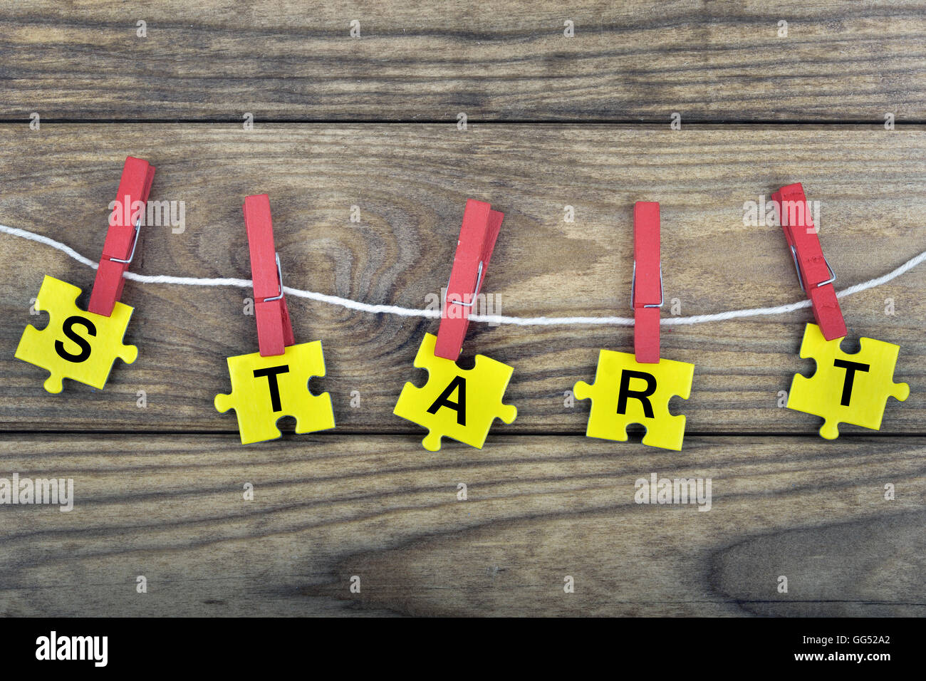 Puzzle pieces with word Start Stock Photo - Alamy