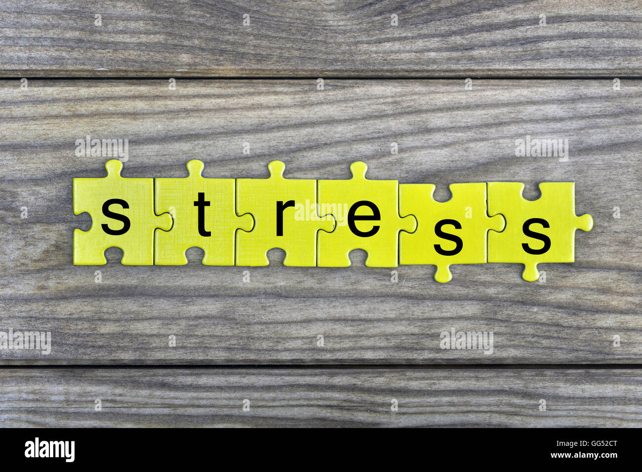 Puzzle pieces with word Stress Stock Photo - Alamy