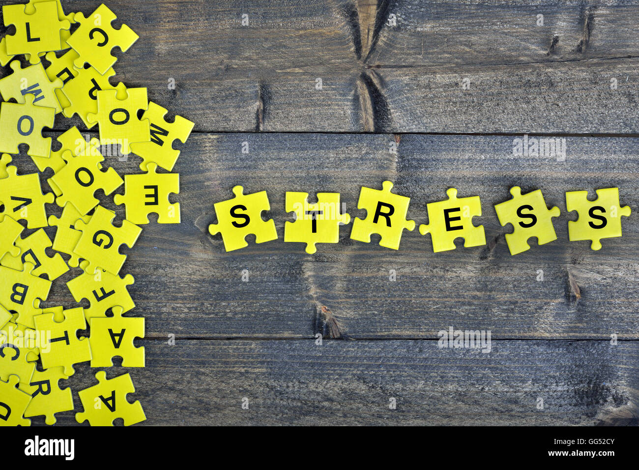 Puzzle pieces with word Stress Stock Photo - Alamy
