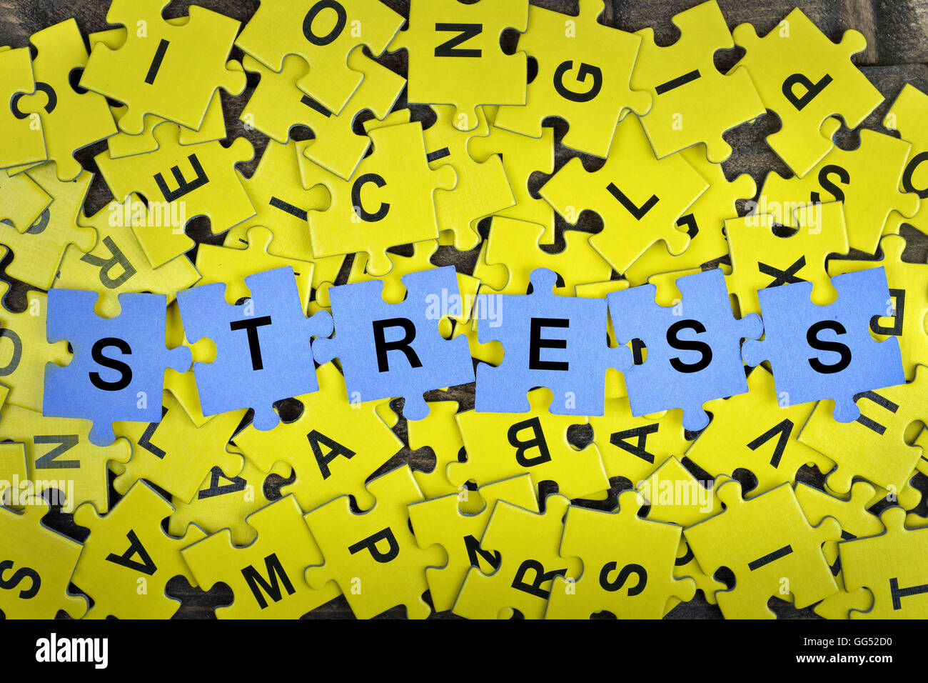 Puzzle pieces with word Stress Stock Photo - Alamy