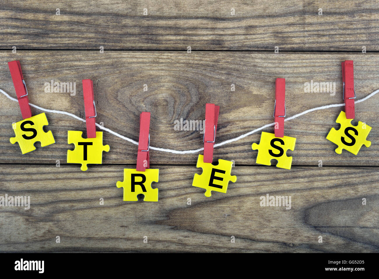 Puzzle pieces with word Stress Stock Photo - Alamy