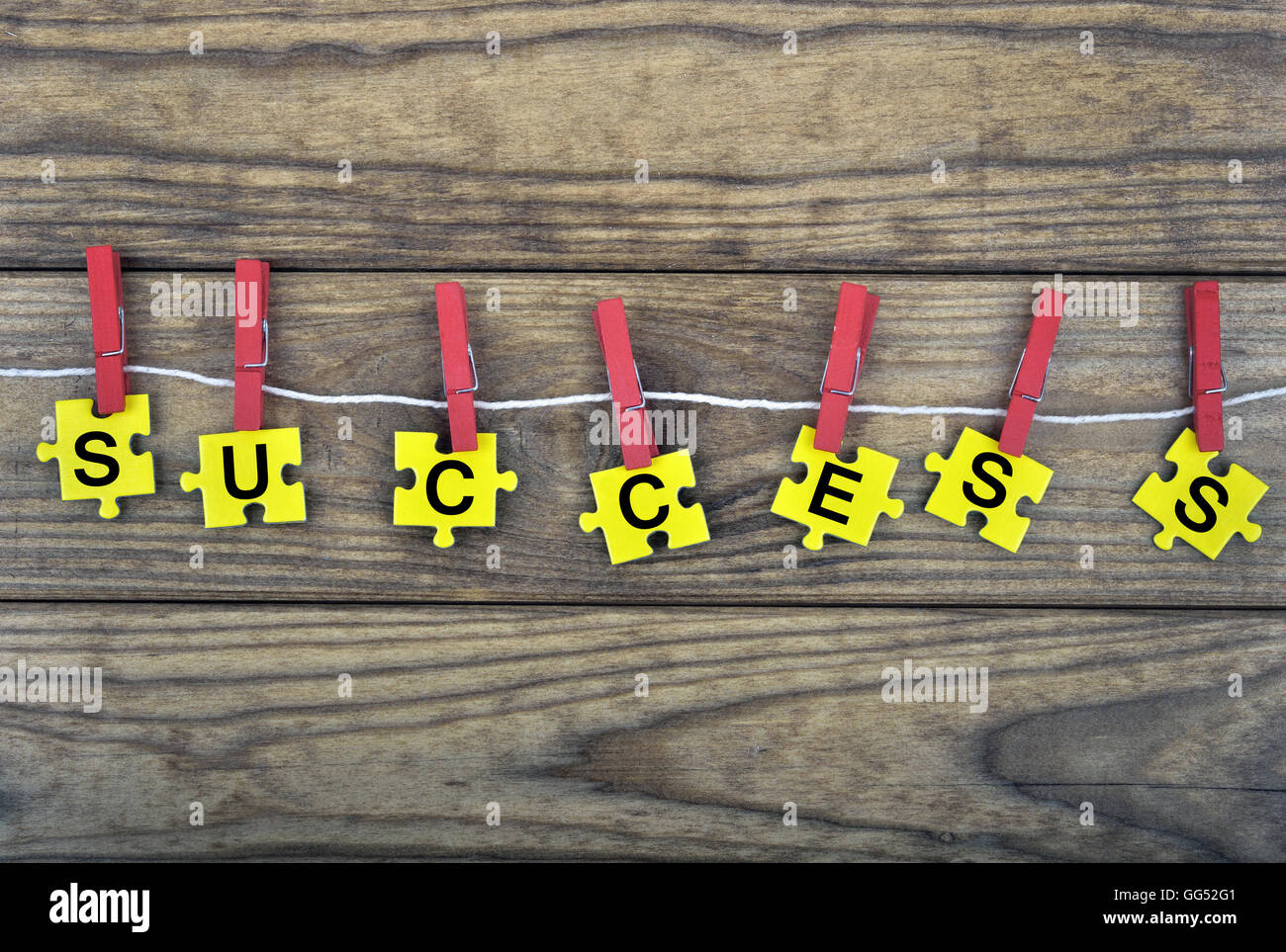 Puzzle pieces with word Success Stock Photo - Alamy