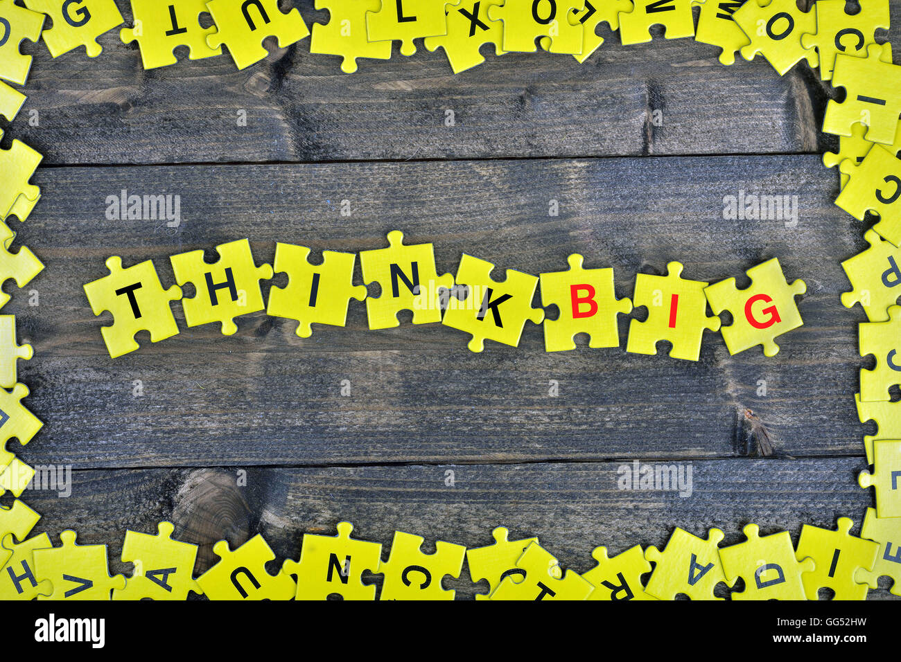Puzzle pieces with word Think Big Stock Photo - Alamy