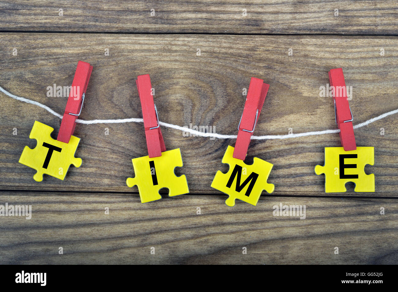Puzzle pieces with word Time Stock Photo - Alamy