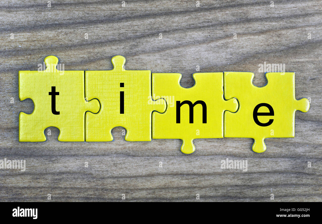 Puzzle pieces with word Time Stock Photo - Alamy