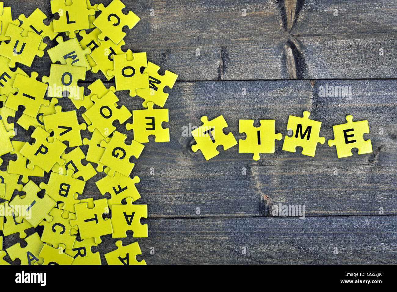 Puzzle pieces with word Time Stock Photo - Alamy